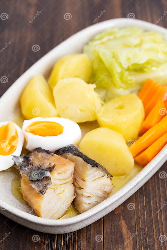 Cod Fish with Boiled Egg and Vegetables on Dish Stock Photo - Image of ...