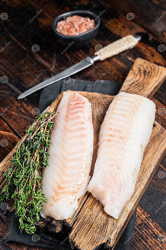 Cod Fish Fillets, Raw Codfish with Thyme on Wooden Board. Wooden ...