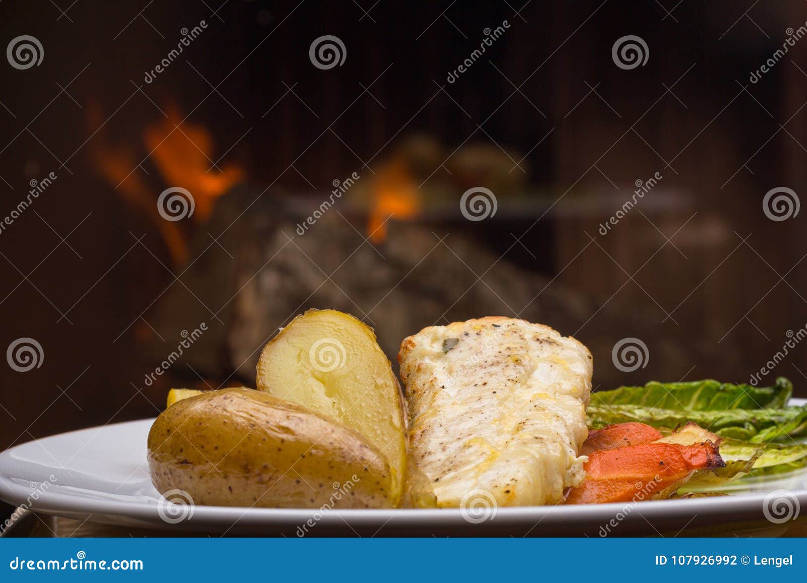 Cod Fish with Potatoes Confit and Sauted Vegetables.. Stock Photo ...