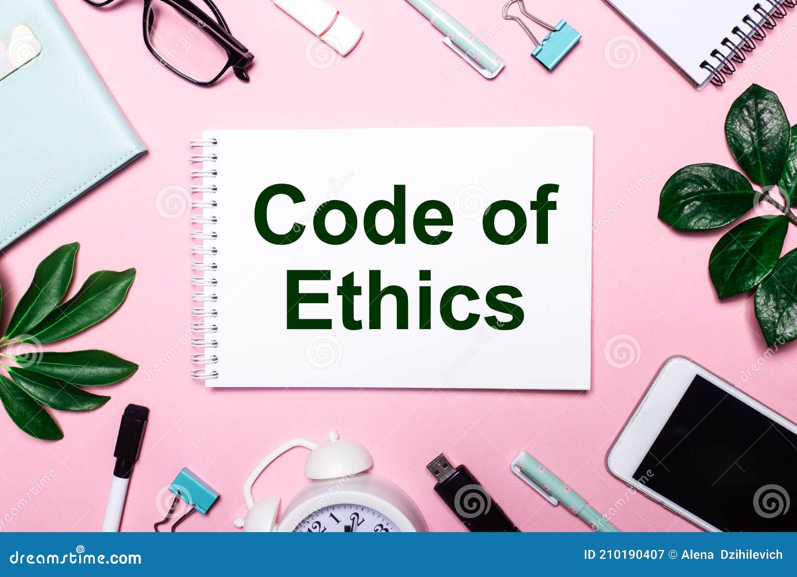 CODE of ETHICS is Written in a White Notebook on a Pink Background ...