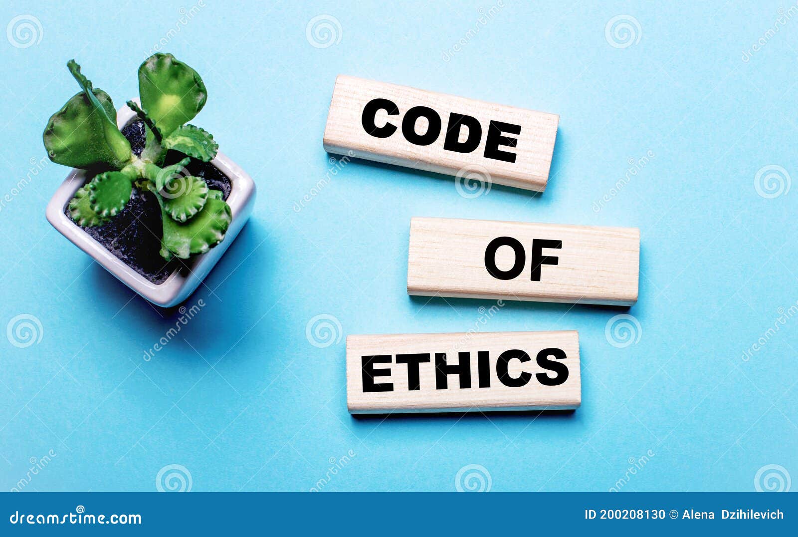 CODE of ETHICS is Written on Wooden Blocks on a Light Blue Background ...