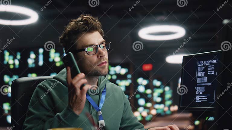 Coder Guy Answering Cellphone Call Coding Computer at Night Workplace Closeup Stock Photo ...