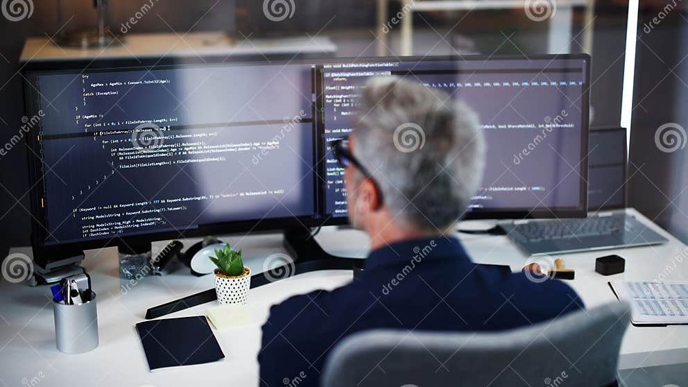 Coder Using Computer at Desk Stock Photo - Image of coding, classes ...