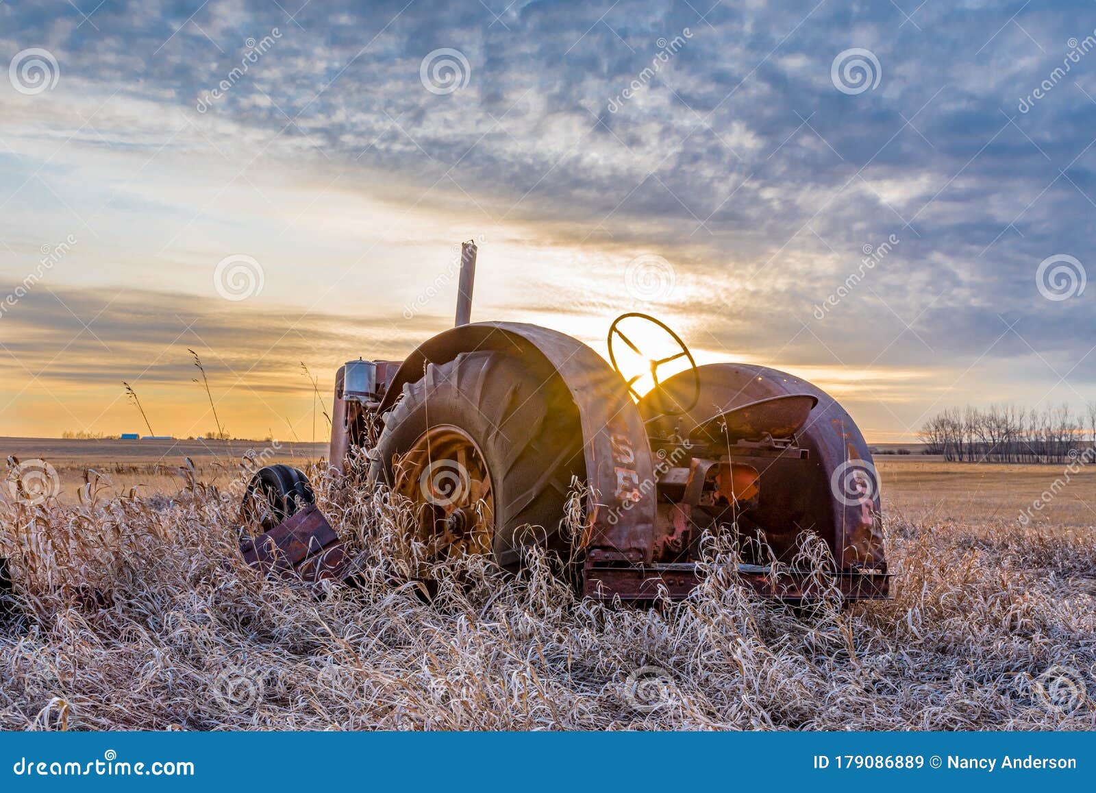 Coderre, SK- April 9, 2020: Sunburst at Sunset Over a Vintage Case ...