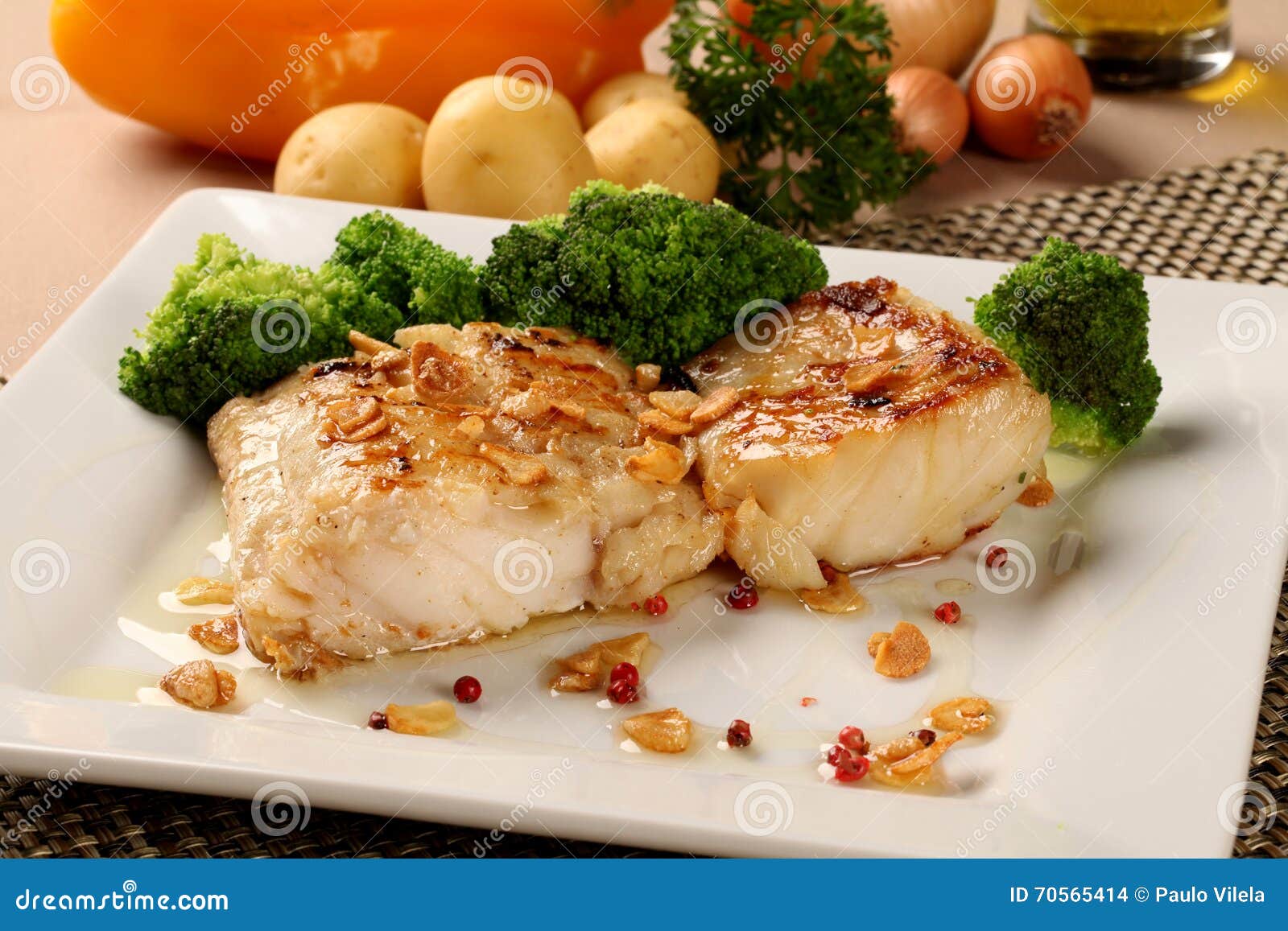 Codfish - Fish Fillet in Sauce with Garlic and Vegetables Stock Photo ...