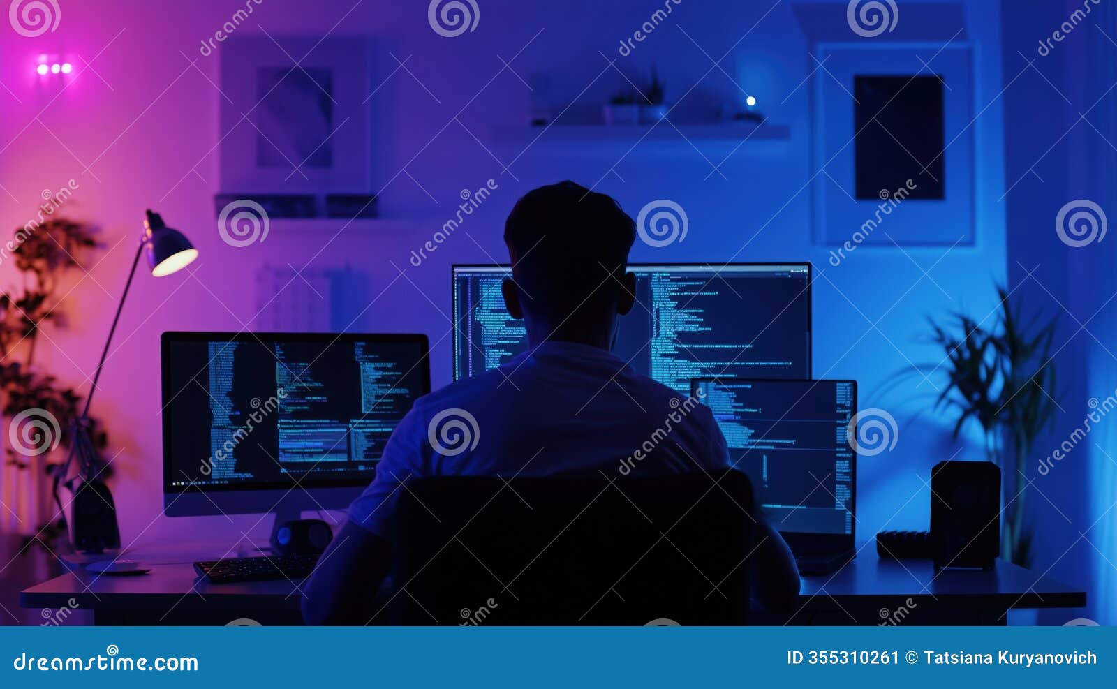 Coding in Dimly Lit Room with Multiple Monitors, Vibrant Colors ...
