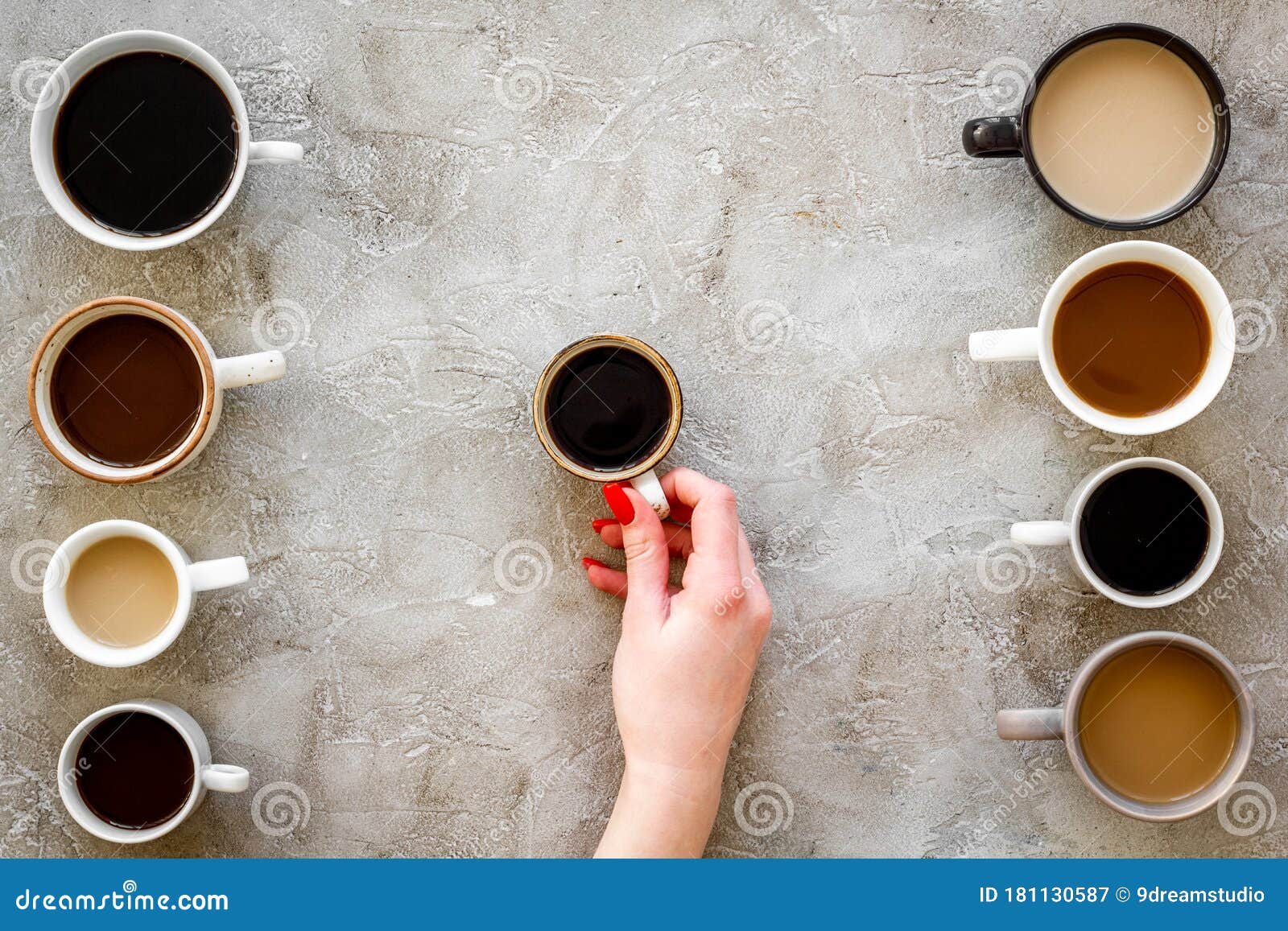 Coffee Addiction. Mug in Hand, Many Cups on Grey Desk Top-down Stock ...