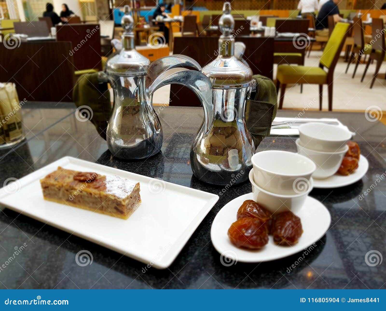 Two Arab Coffee Pots, Cups, Dates, Cake on the Table in a Cafe. Stock ...