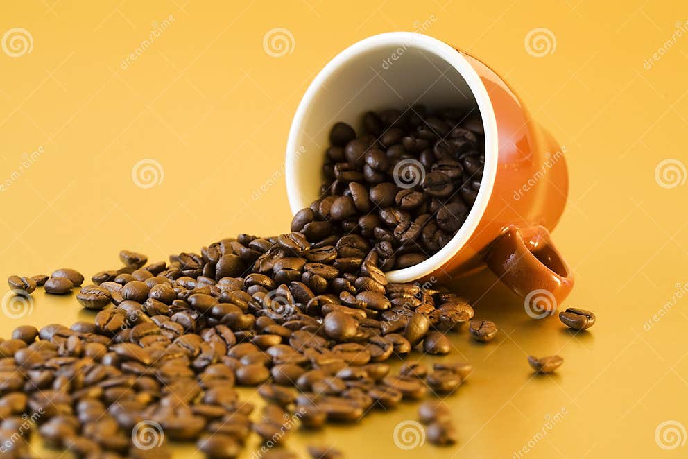 Coffee Beans Falling from Mug Stock Photo - Image of tilted, brown: 7142348