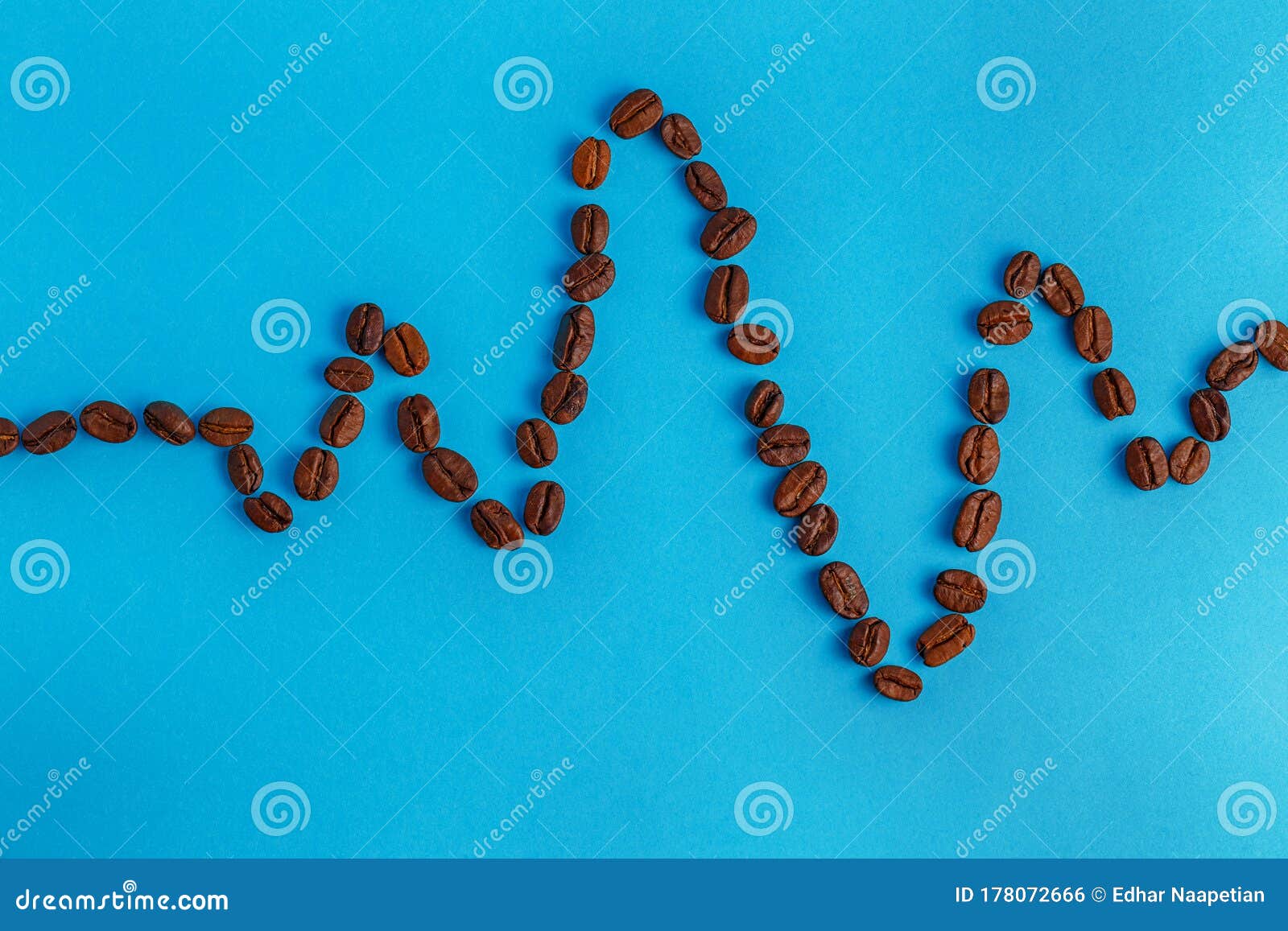 Coffee Beans Show a Bullet on a Blue Background Stock Photo - Image of ...