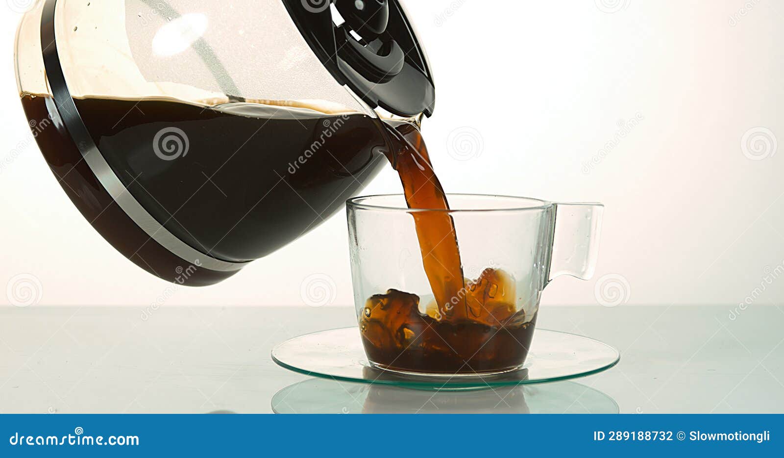 Coffee Being Poured in a Cup Against White Background Stock Photo ...