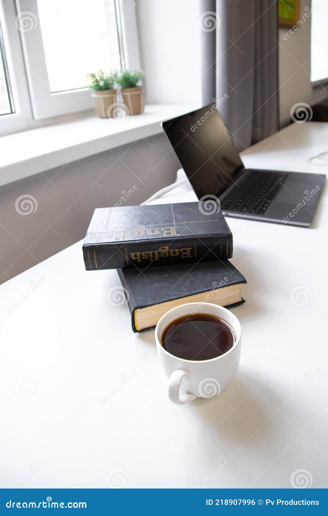 Coffee, Books and a Laptop on a Light Table by the Window Stock Photo ...