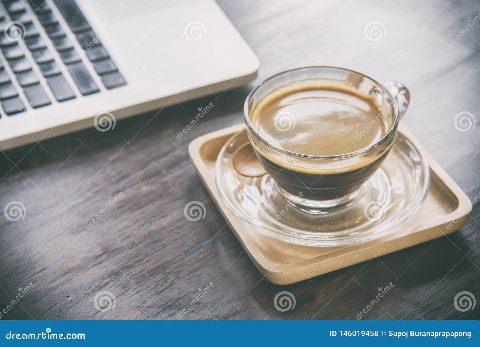 Coffee Break Time at Workplace.a Glass of Black Coffee on Wooden Table ...