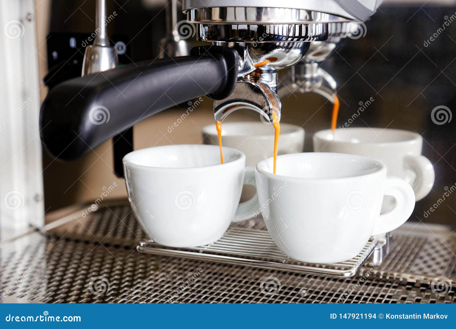 Coffee Brewing in Coffee Machine. Espresso Pouring in Two Cups Stock ...