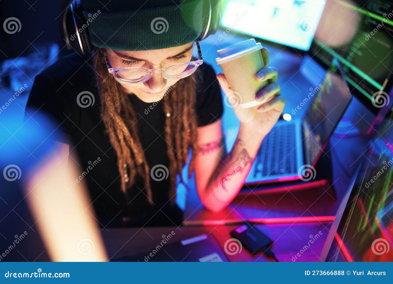 Girl Hacker In A Hood Typing Program Code While Committing A Cybercrime