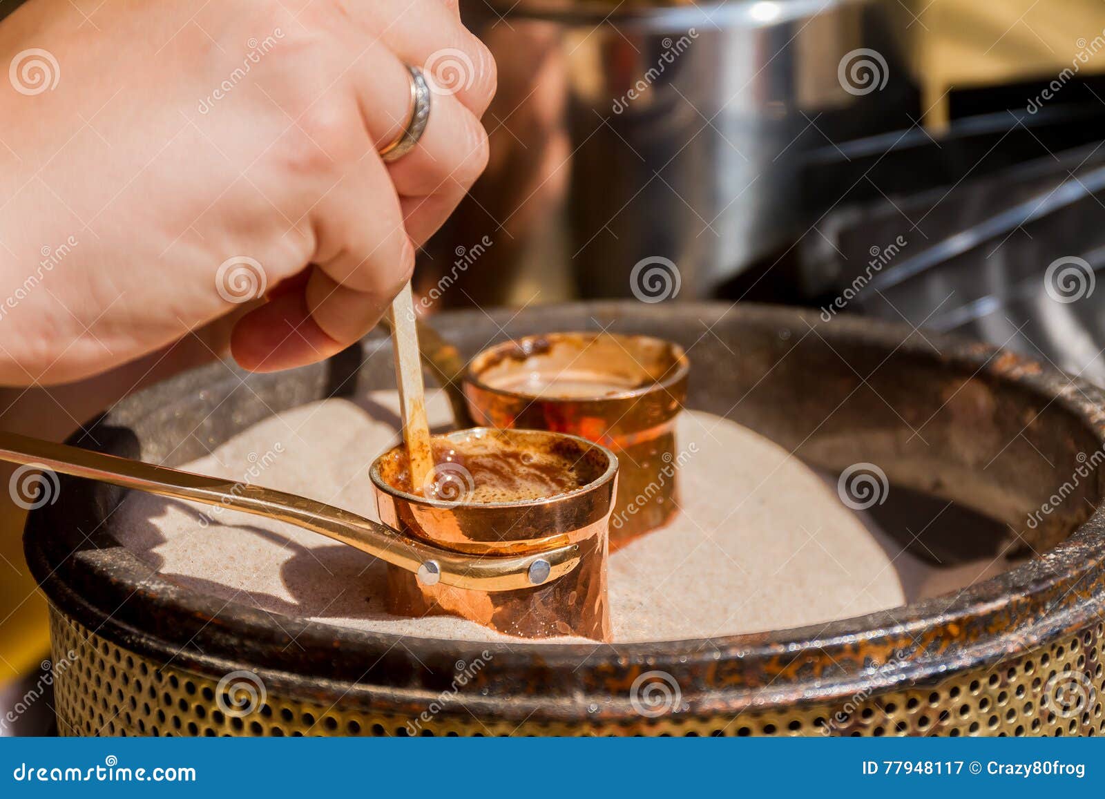 Coffee cooking on sand stock image. Image of leisure - 77948117