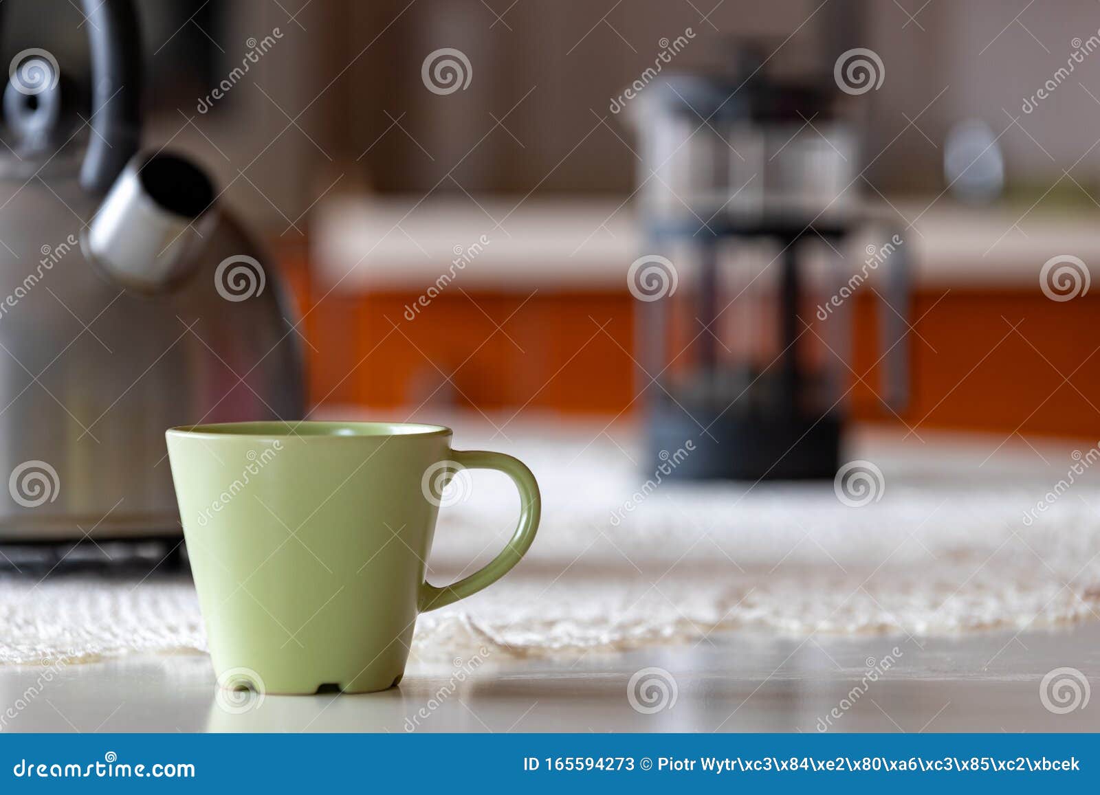 Coffee Cup and Metal Kettle on the Kitchen Table. Morning Coffee in the ...