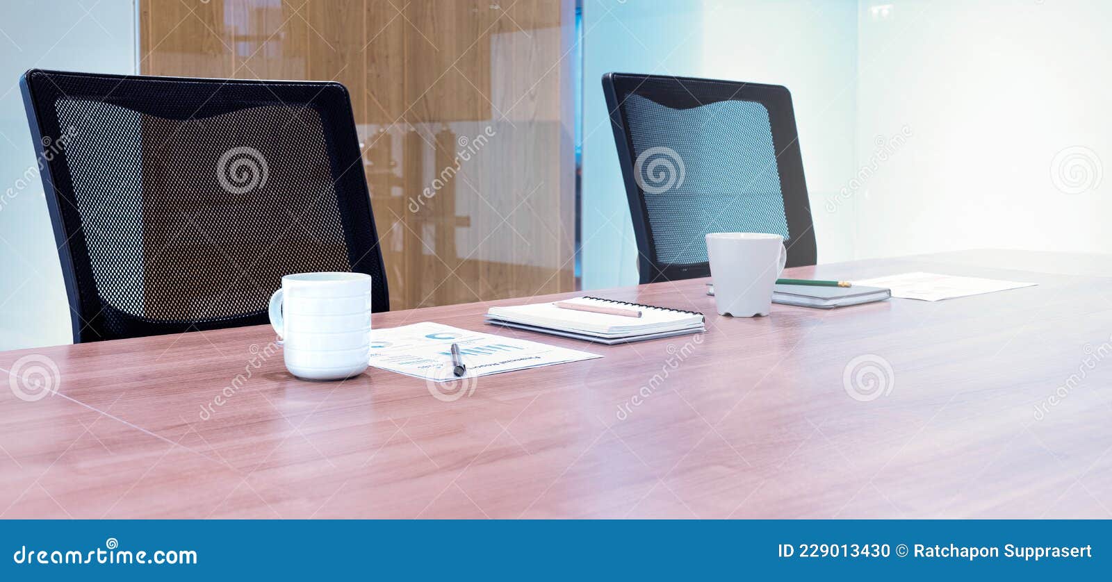 Coffee Cup ,paperwork and Notebook on Table with Two Black Armchairs in ...