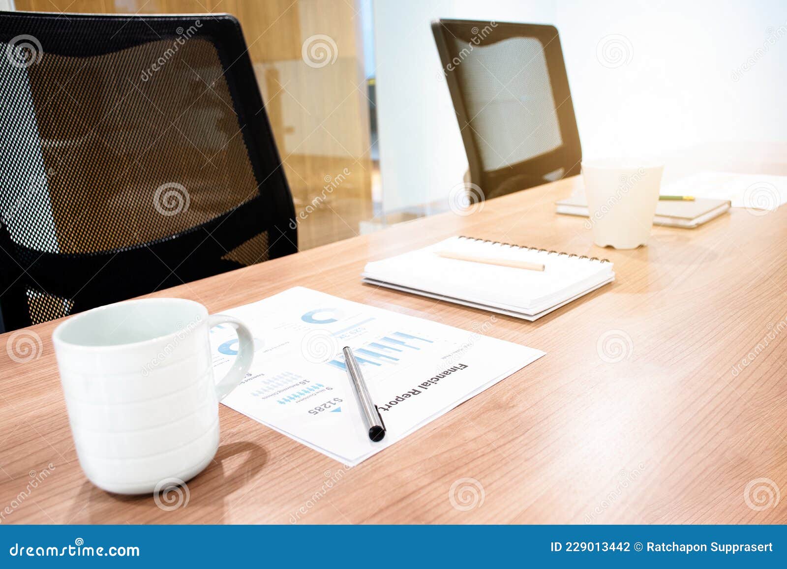 Coffee Cup ,paperwork and Notebook on Table with Two Black Armchairs in ...