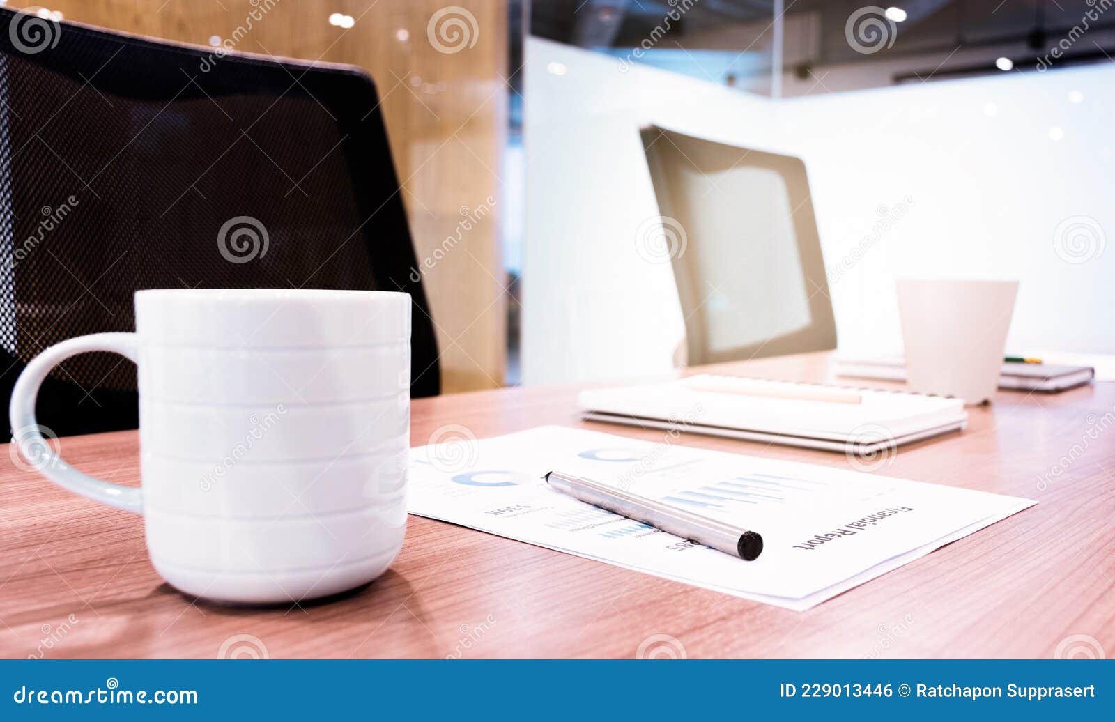 Coffee Cup ,paperwork and Notebook on Table with Two Black Armchairs in ...