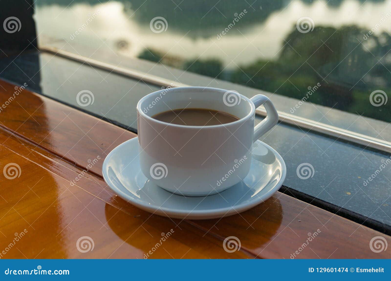Coffee Cup on a Table in Cafe with Water View Stock Photo - Image of ...