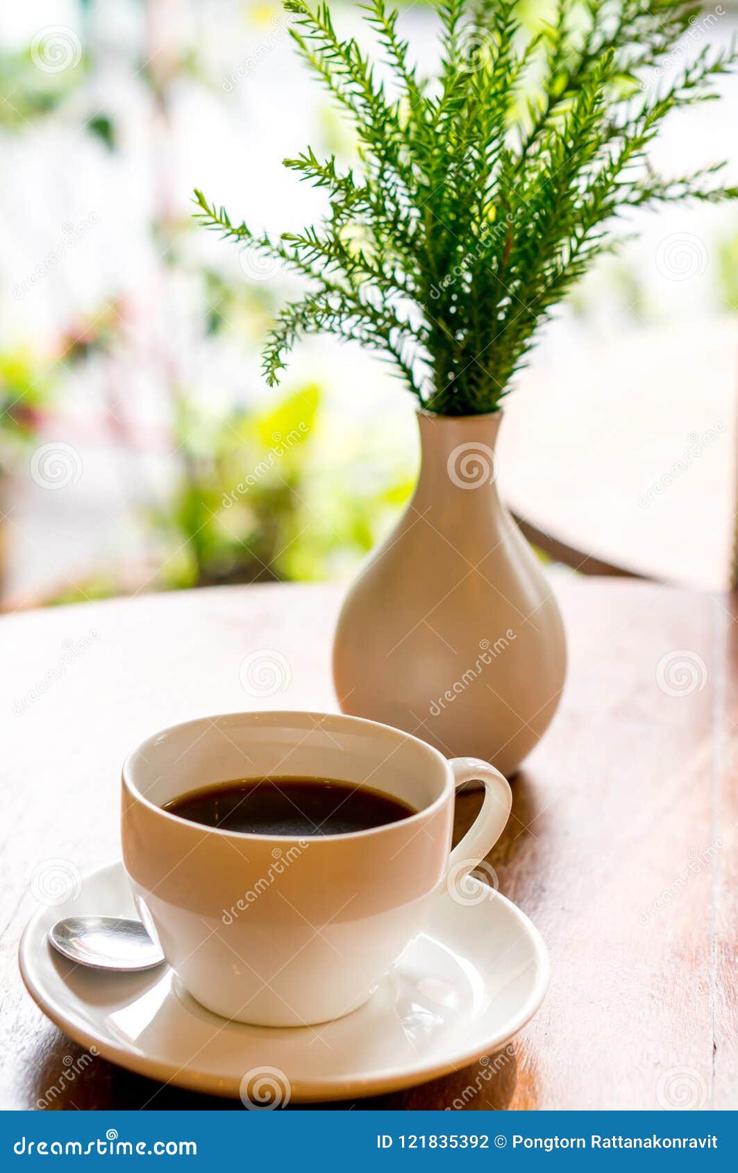 Coffee cup on wood table stock photo. Image of board - 121835392