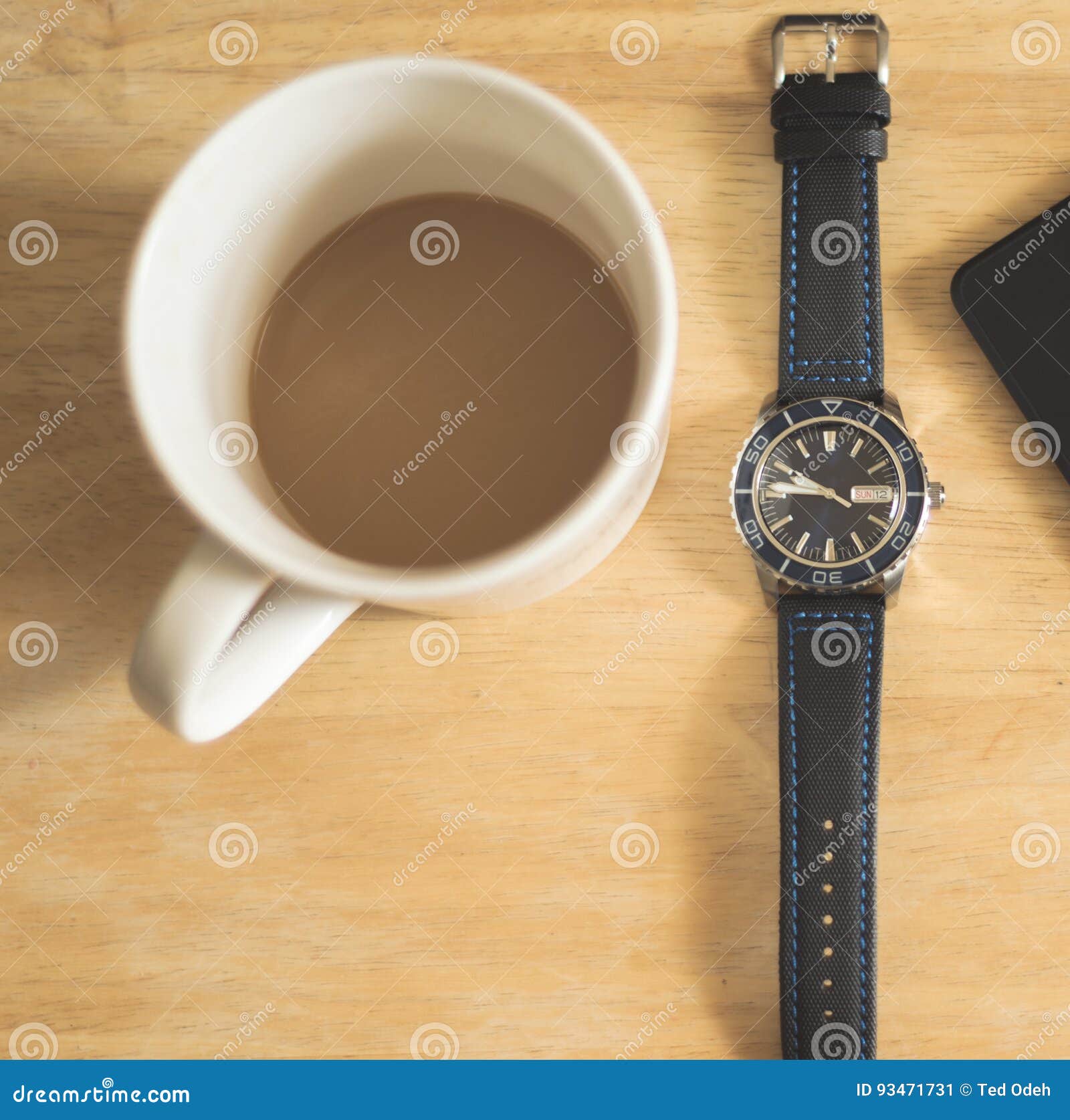 Coffee cup and wrist watch stock image. Image of table - 93471731