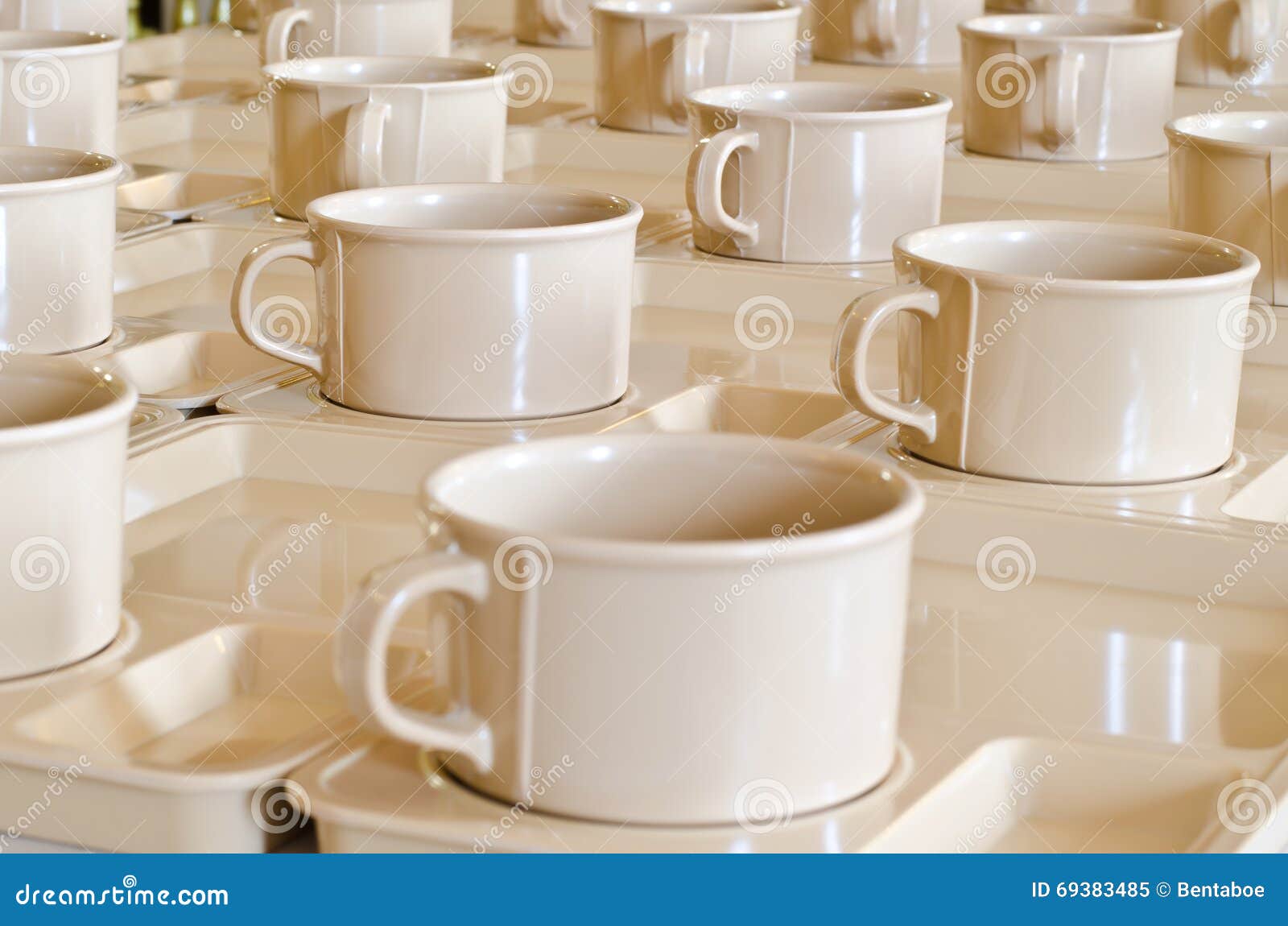 Coffee cups on plates stock image. Image of large, self - 69383485