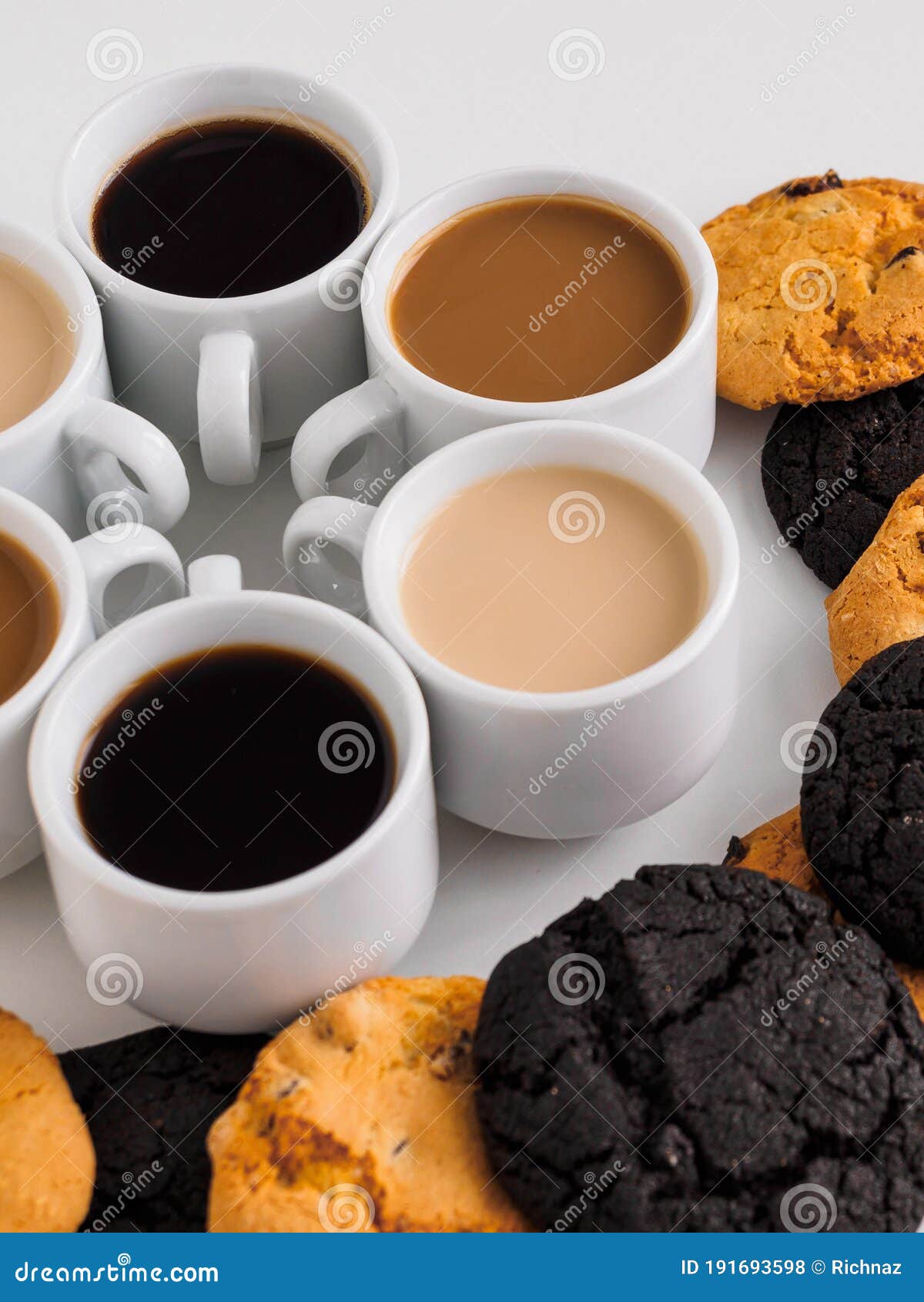 Coffee Cups Set in a Circle and Lots of Sweets Stock Photo - Image of ...