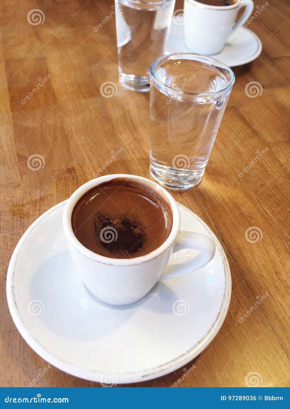 Coffee Cups and Water on Wooden Table Stock Photo - Image of restaurant ...