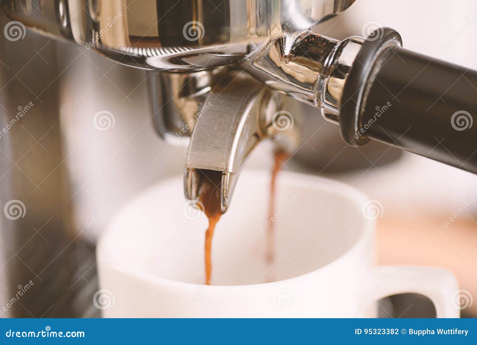 Coffee flowing into a cup stock photo. Image of flow - 95323382