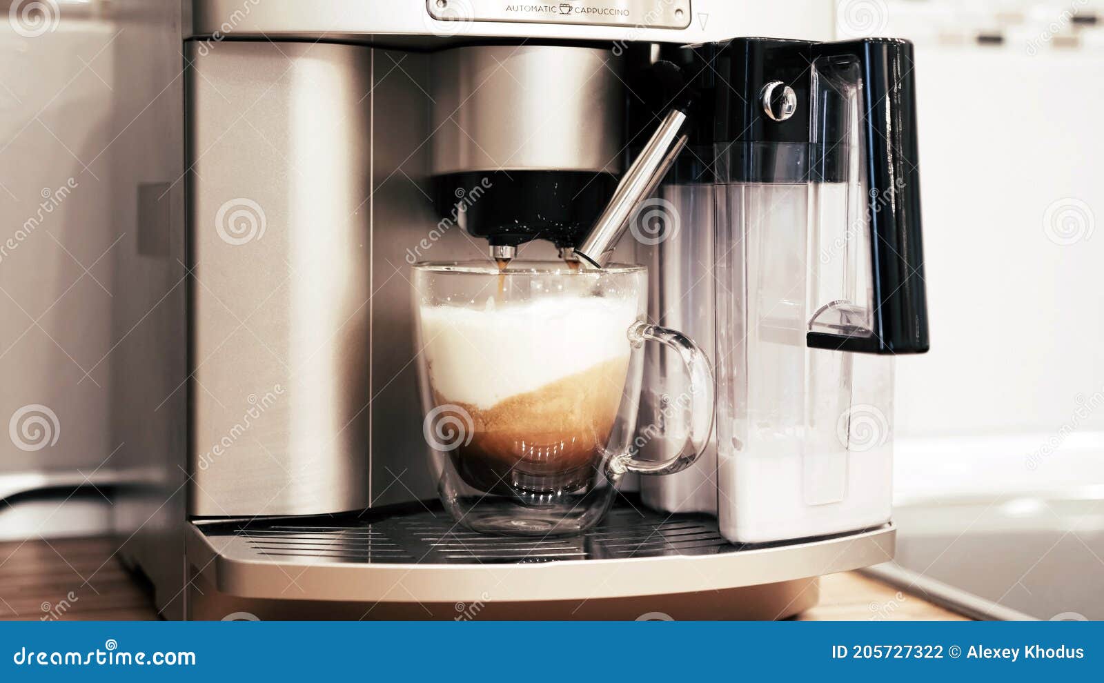 The Coffee Machine Adds Coffee To the Cream and they Mix Slowly Stock ...
