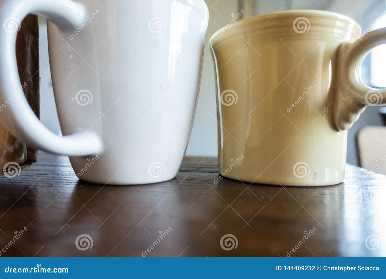 Coffee mugs on wood table stock photo. Image of natural - 144409232