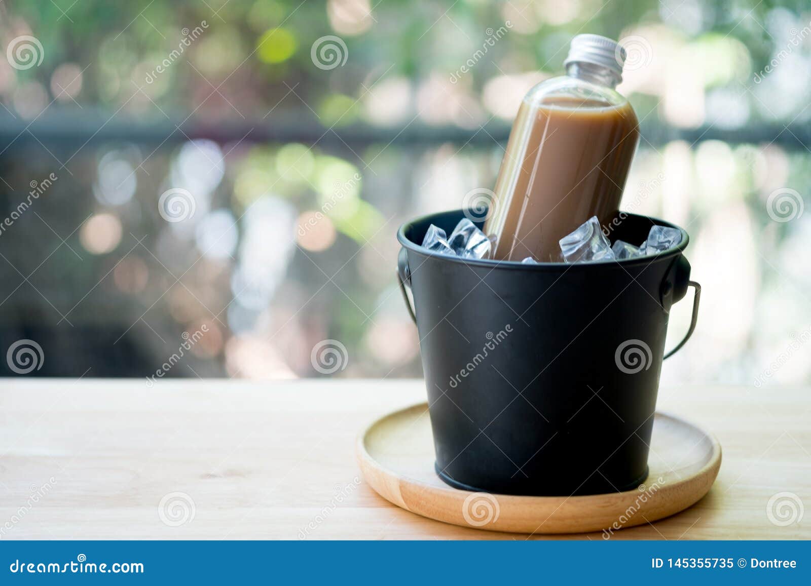 Coffee in Plastic Bottle Served in Ice Bucket Stock Image - Image of ...