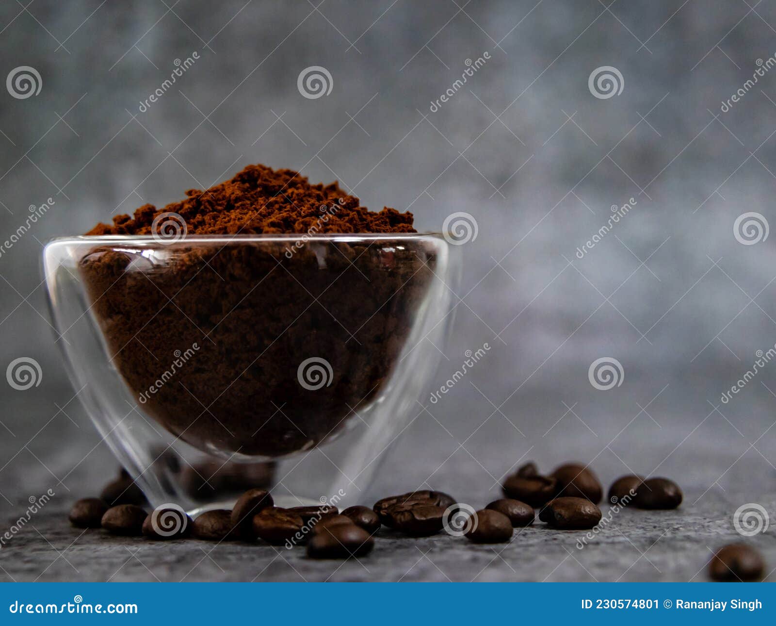 Coffee Powder in Glass Bowl with Beans Scattered Below Stock Image ...
