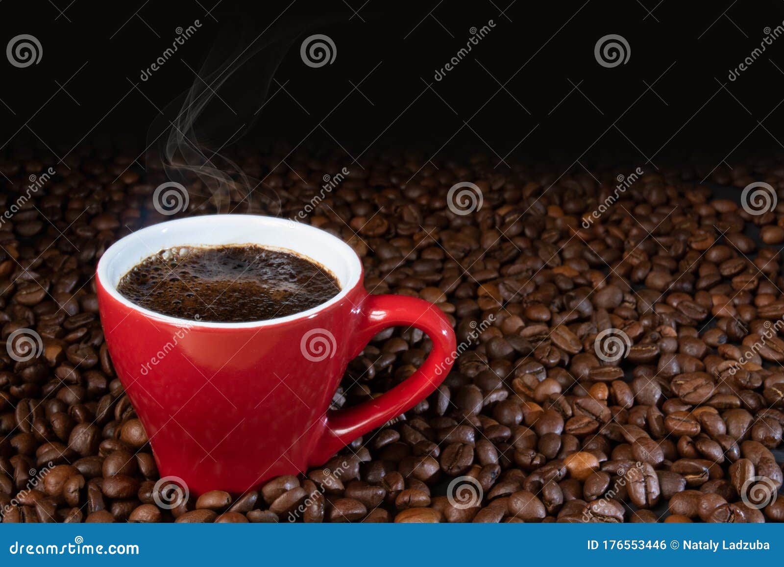 Coffee in a Red Cup with Steam on the Background of Coffee Beans Stock ...