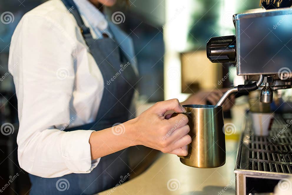 Coffee Shop Assistant Preparing Coffee in a Coffee Store Stock Image ...