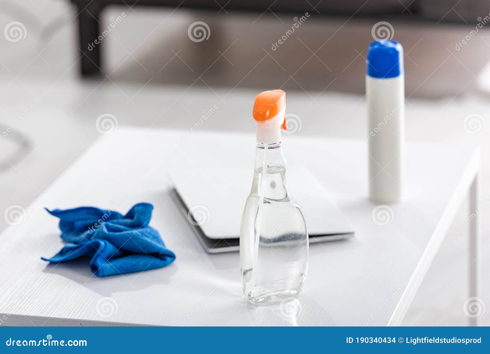 Coffee Table with Laptop, Spray Bottles Stock Photo - Image of bottles ...
