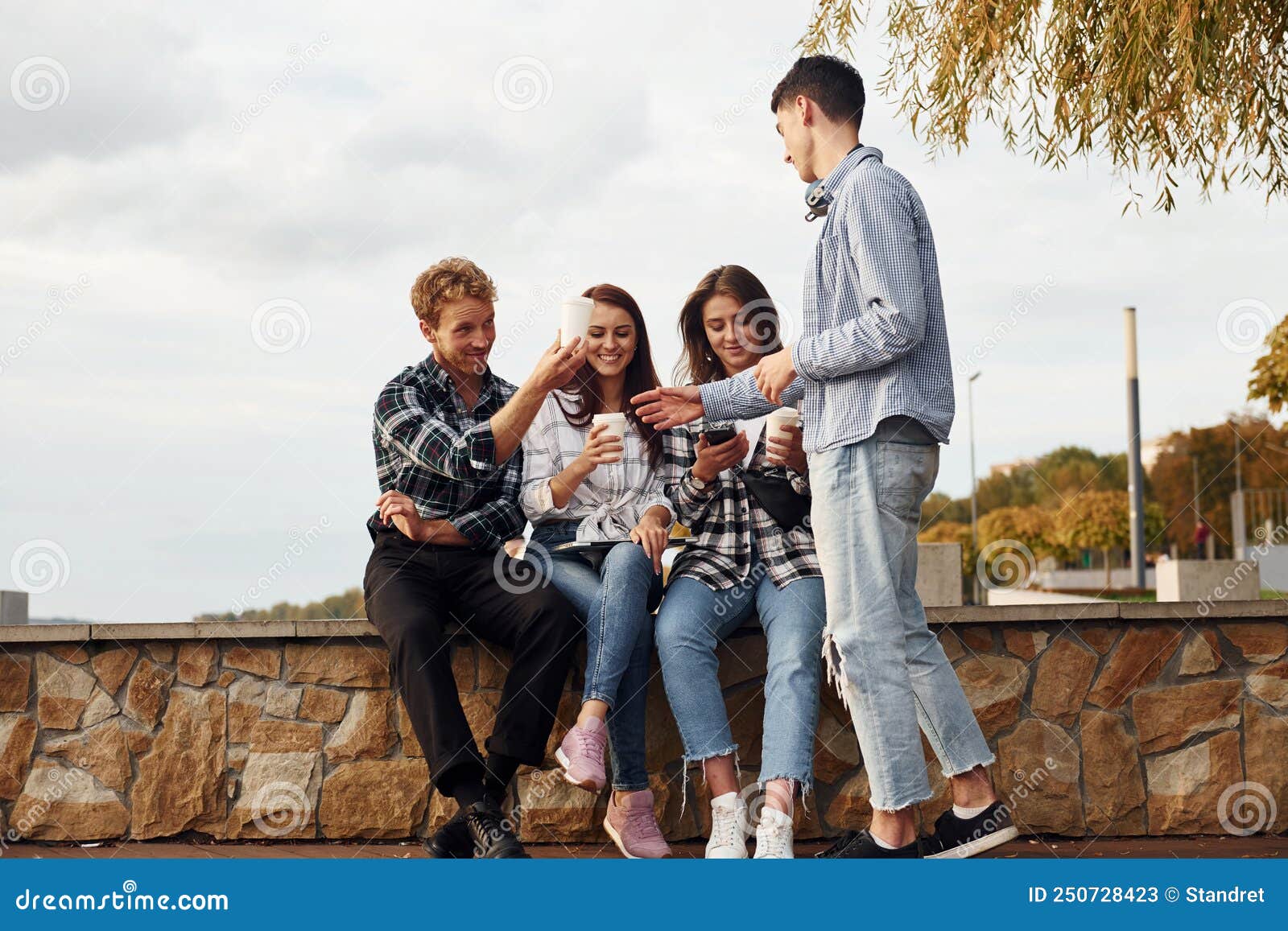 Coffee Time. Group of Young Cheerful Friends that is Outdoors Having ...