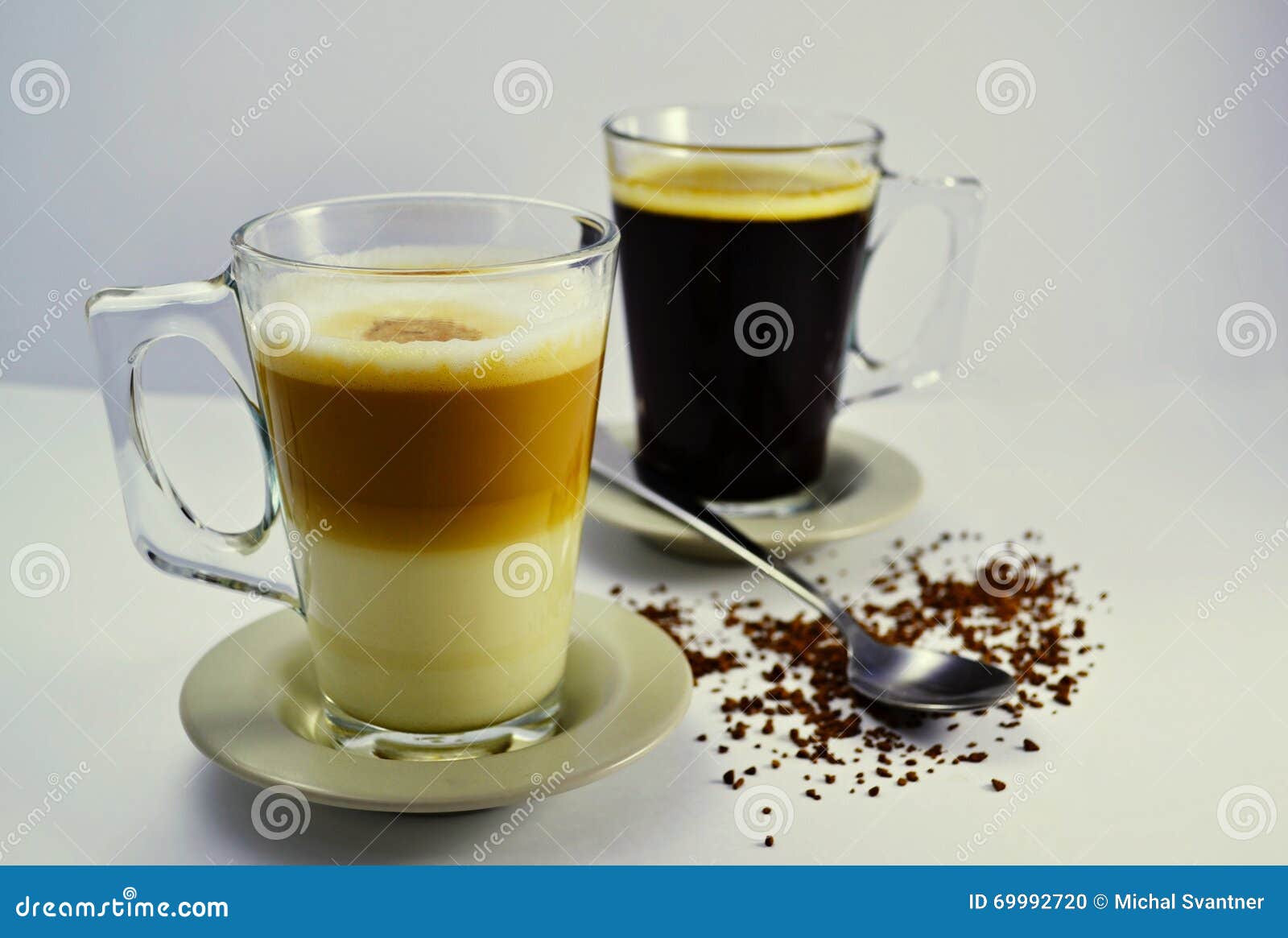 Coffee White and Black with a Teaspoon and Spilled Coffee on the Cloth ...