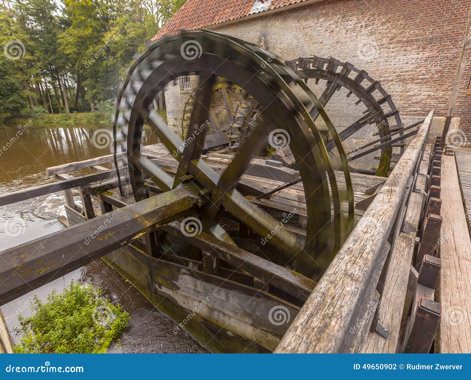 Cogwheels at a watermill stock photo. Image of denekamp - 49650902