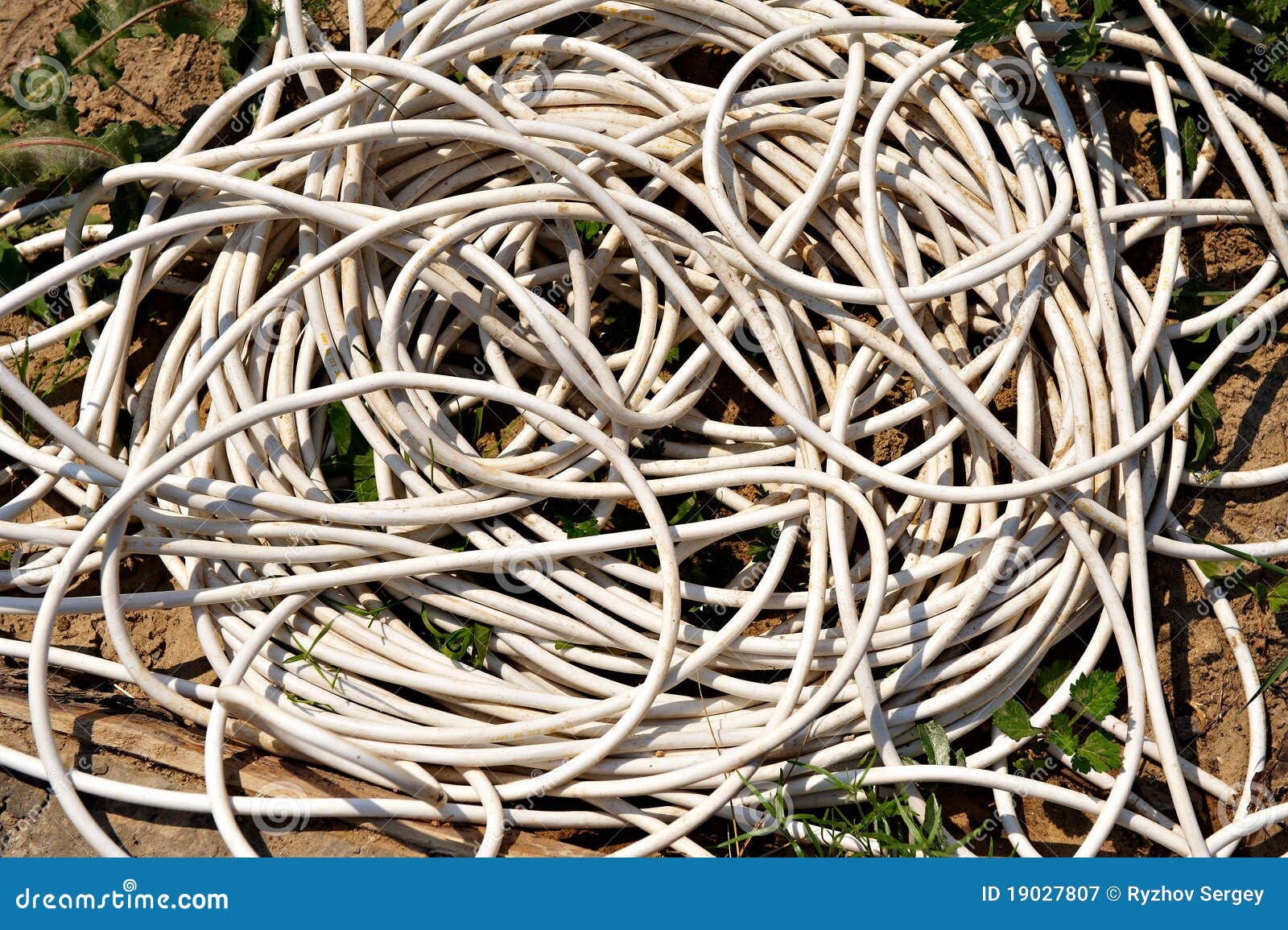Coil of Electrical Wire Lying on the Ground Stock Image - Image of ...