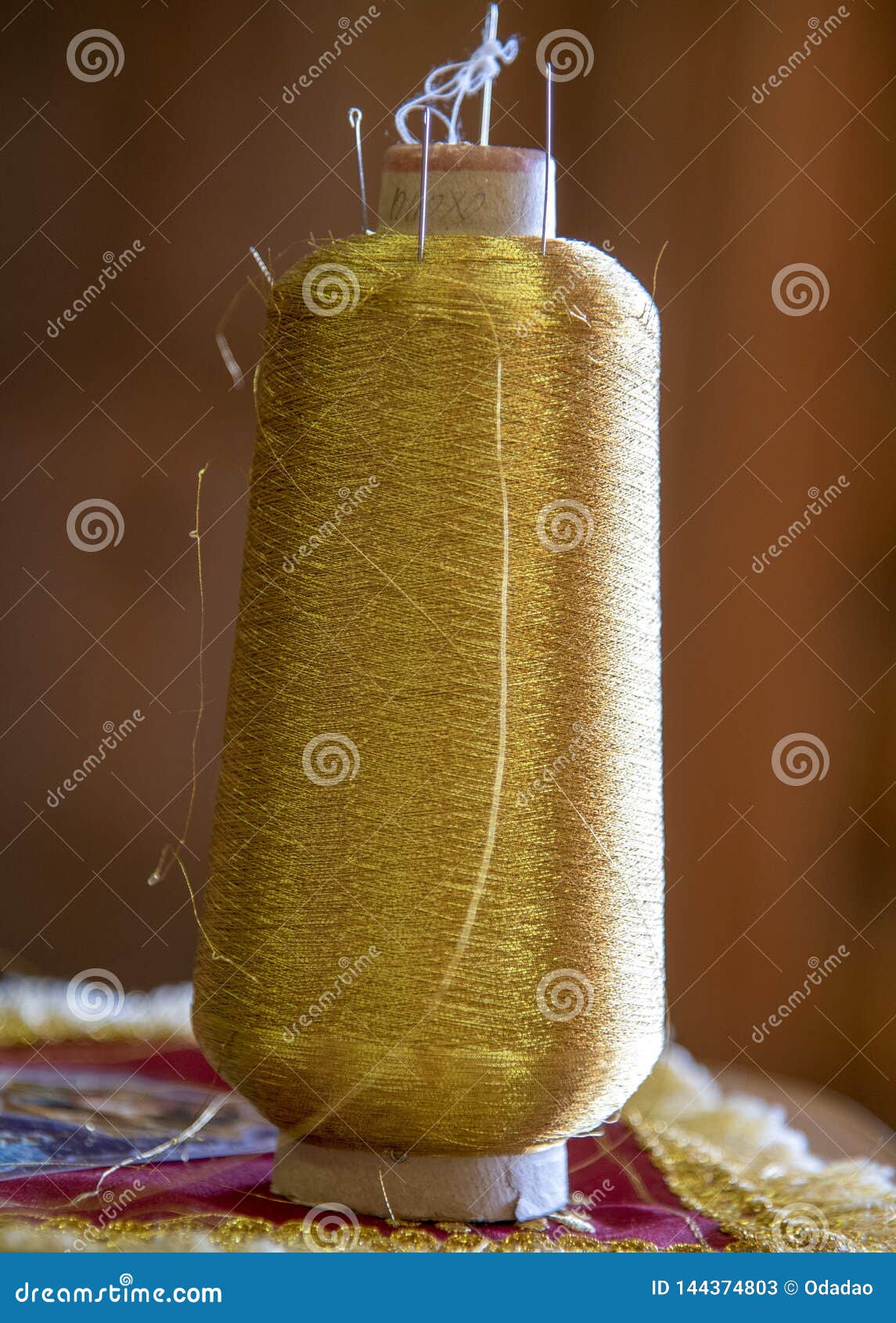 A Coil of Gold Thread Stands on the Table. the Coil is Inserted the ...