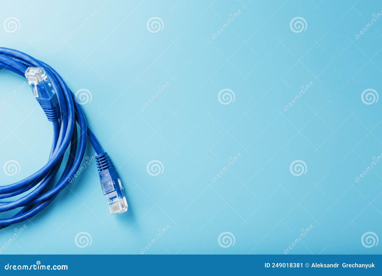 A Coil of an Internet Network Cable for Data Transmission on a Blue ...