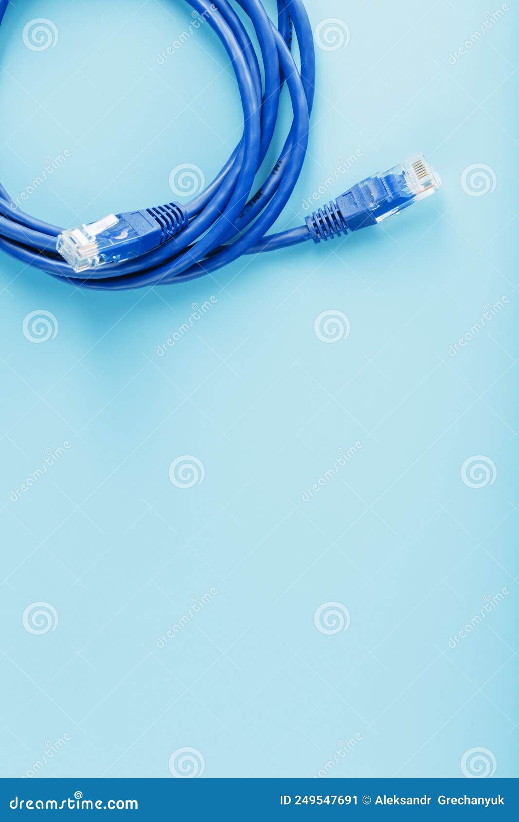 A Coil of an Internet Network Cable for Data Transmission on a Blue ...