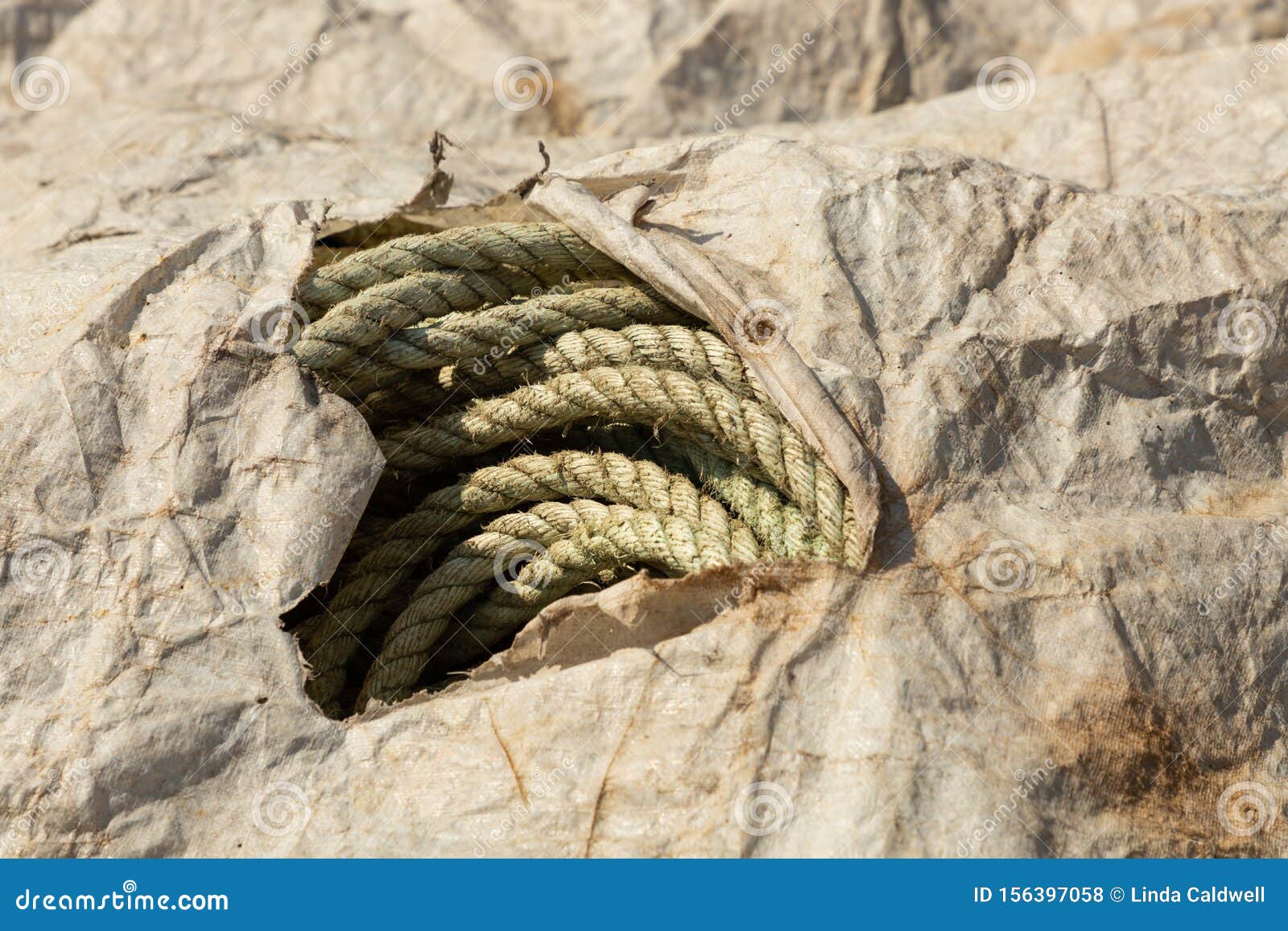 Coil of Rope Showing through a Hole Stock Photo - Image of textiles ...