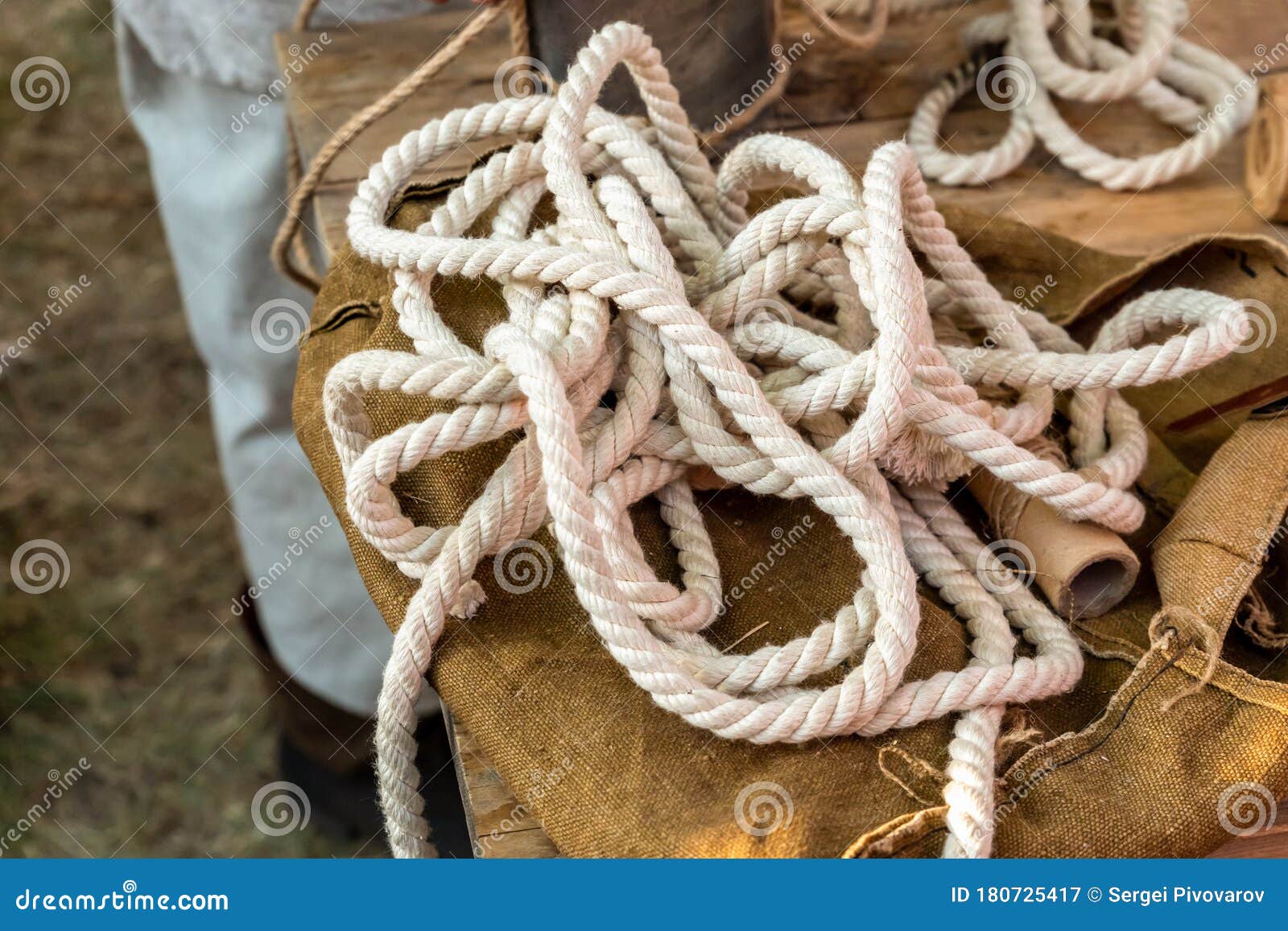 Coil of Tangled White Rope Close Up Lies on Top of a Backpack Stock ...