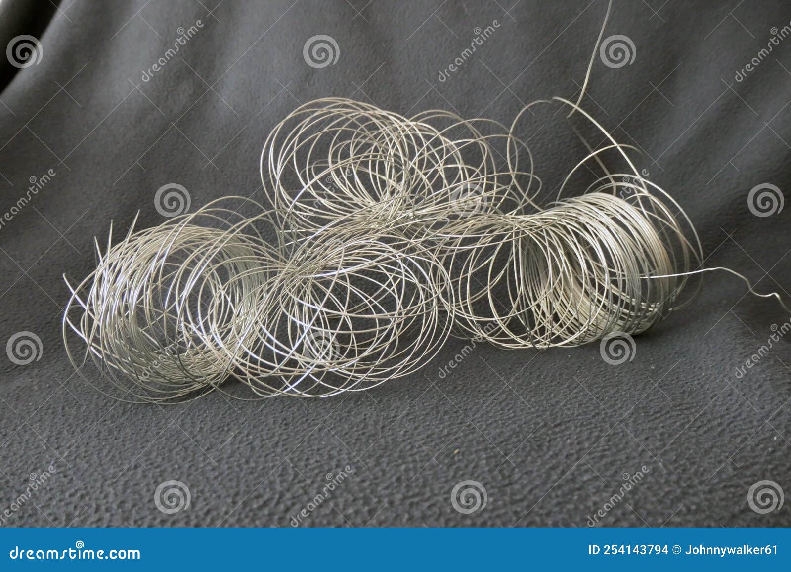 Coil of Thin Steel Wire on Cloth Background Stock Photo - Image of ...
