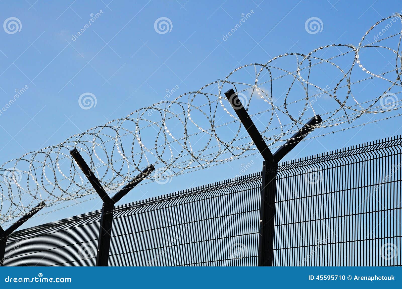 Coiled Barbed Wire Security Fence. Stock Photo - Image of metal, barbed ...
