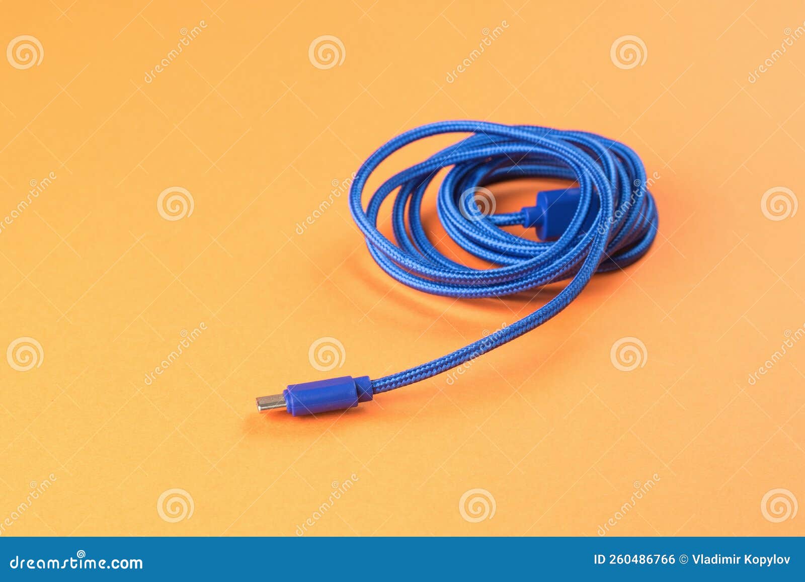 Coiled Blue Usb Wire on an Orange Background Stock Photo - Image of ...